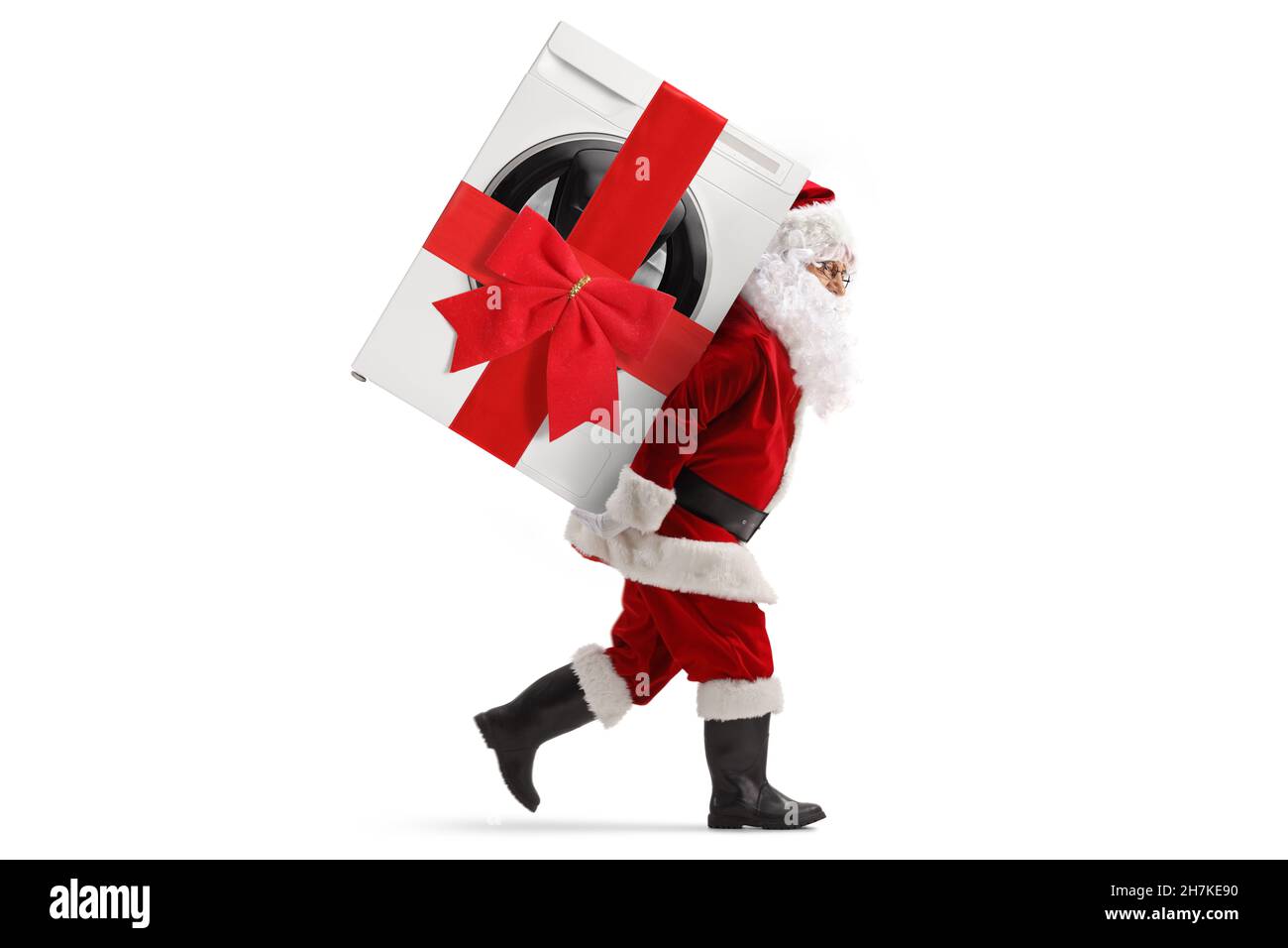 Full length profile shot of santa claus carrying a wrapped washing ...