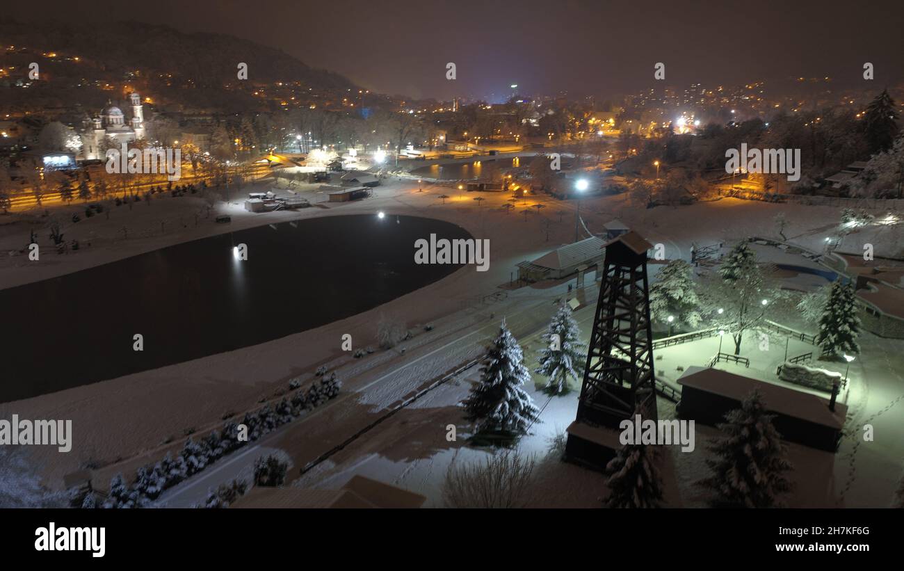 Aerial view of snow-covered town during snow storm at nighttime Stock ...