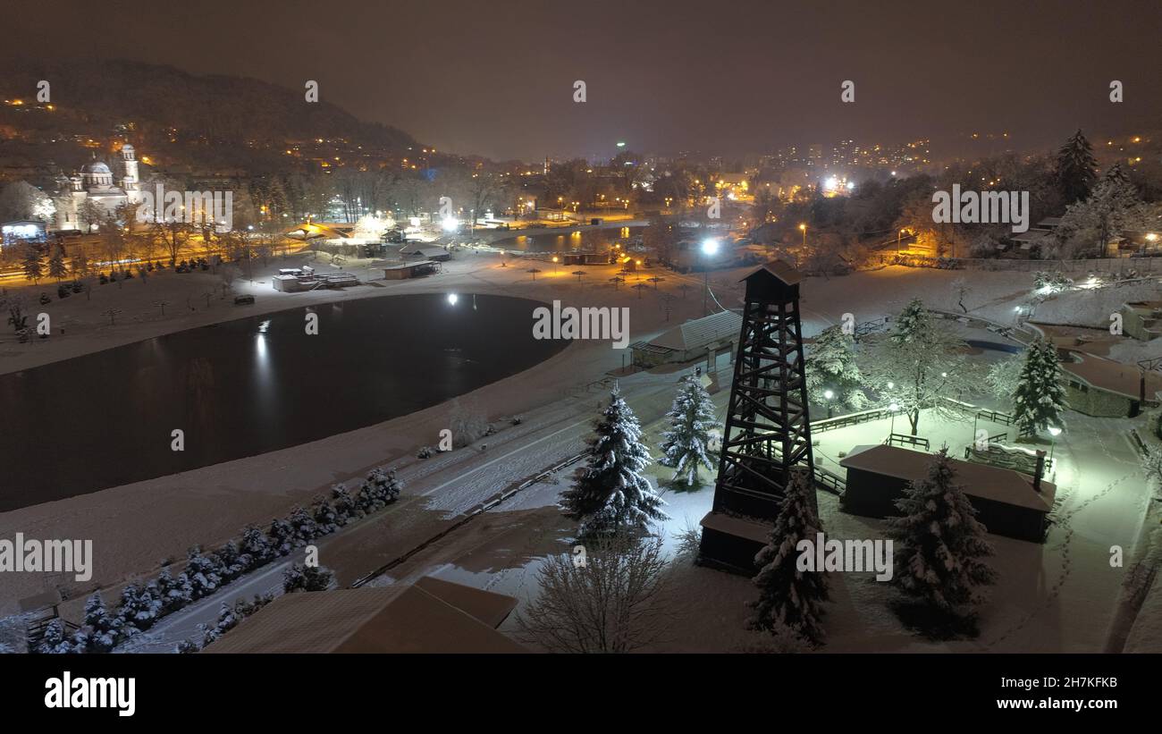 Aerial view of snow-covered town during snow storm at nighttime Stock ...