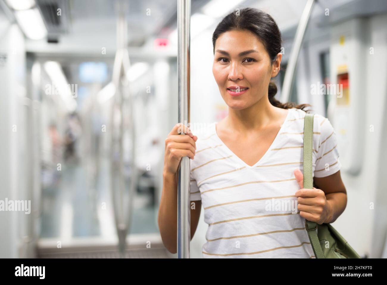 Woman standing in metro wagon hi-res stock photography and images - Alamy