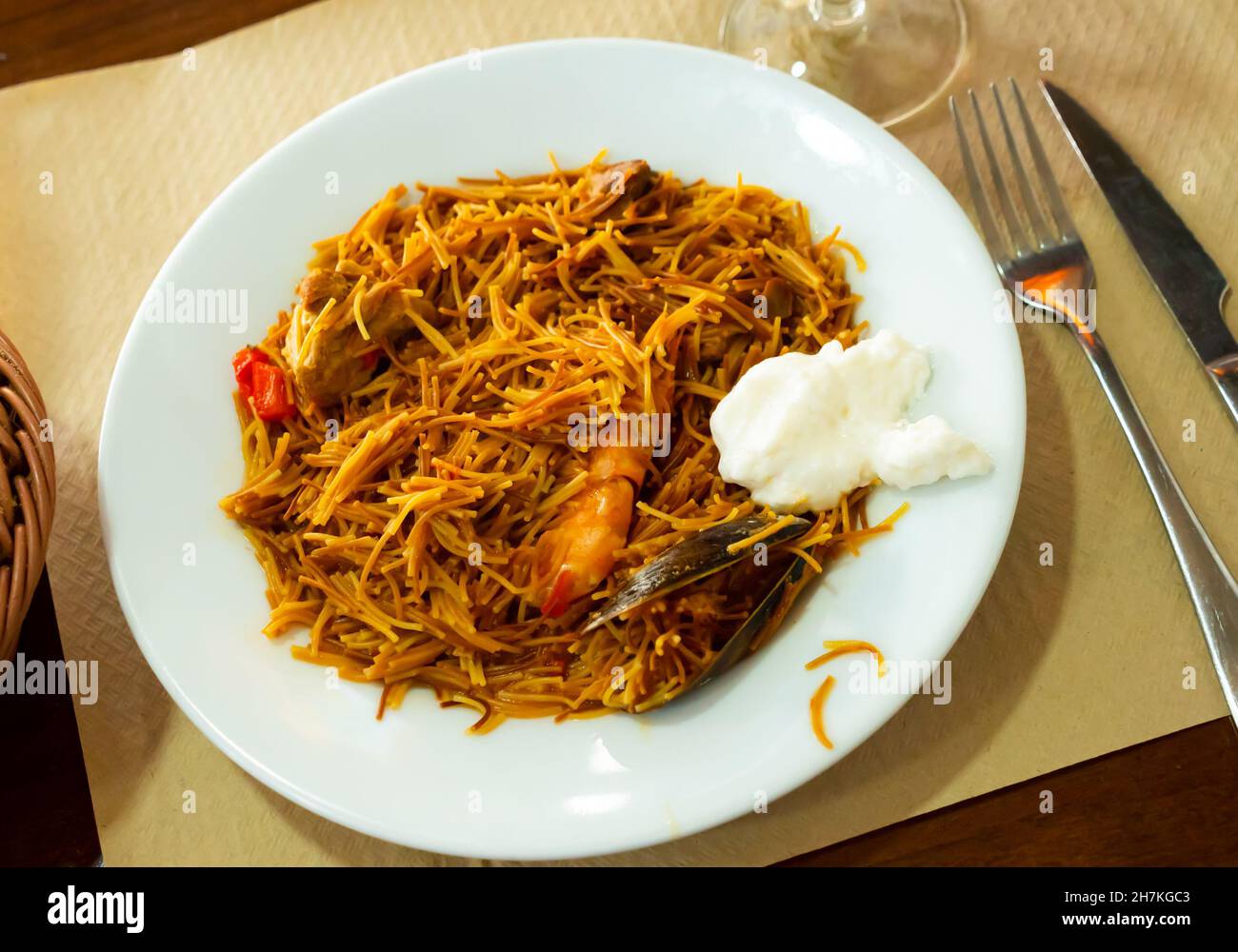 Paella with fideua, pasta noodles and seafood Stock Photo - Alamy