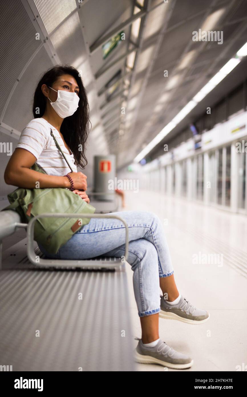 Woman alone subway station hi-res stock photography and images - Alamy