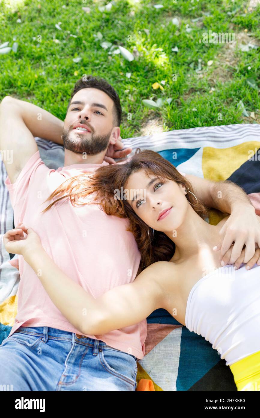 Girlfriend smiling while looking at boyfriend Stock Photo - Alamy
