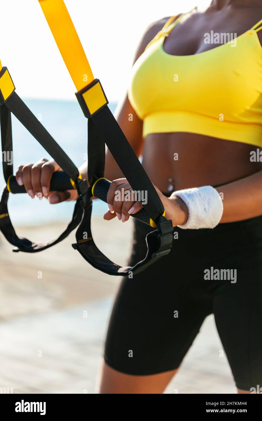 Women fitness training suspension straps hi-res stock photography and ...