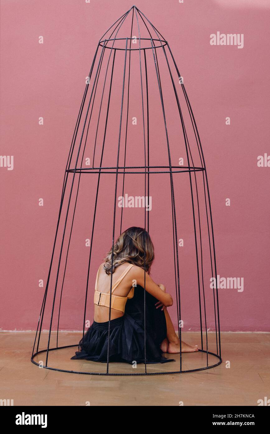 Woman in cage hi-res stock photography and images - Alamy