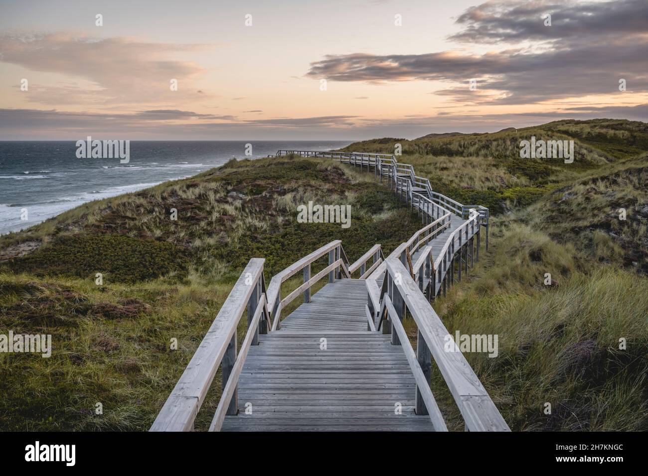 Empty coastal boardwalk at dusk Stock Photo - Alamy