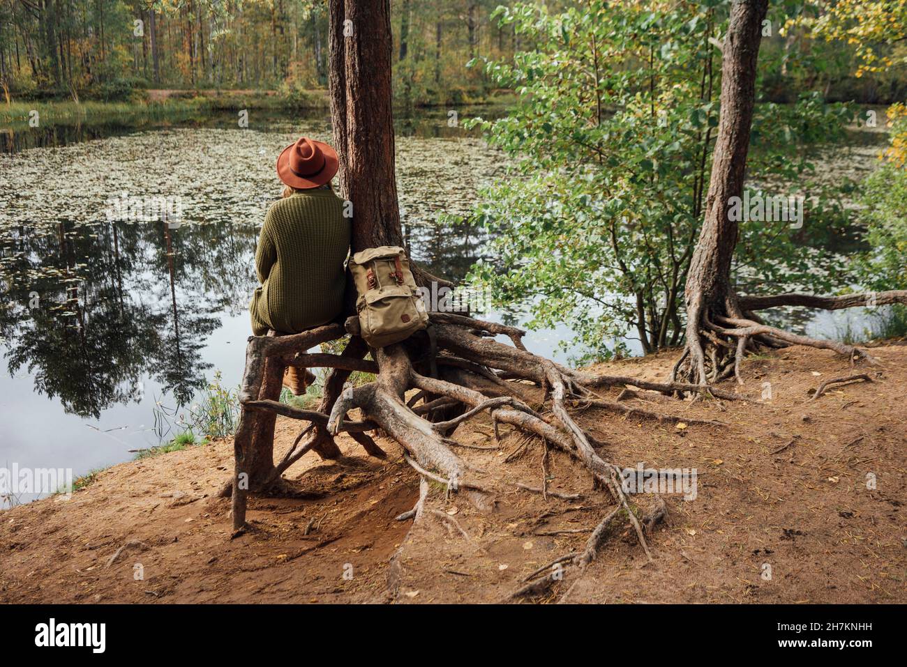 Sitting near tree hi-res stock photography and images - Alamy