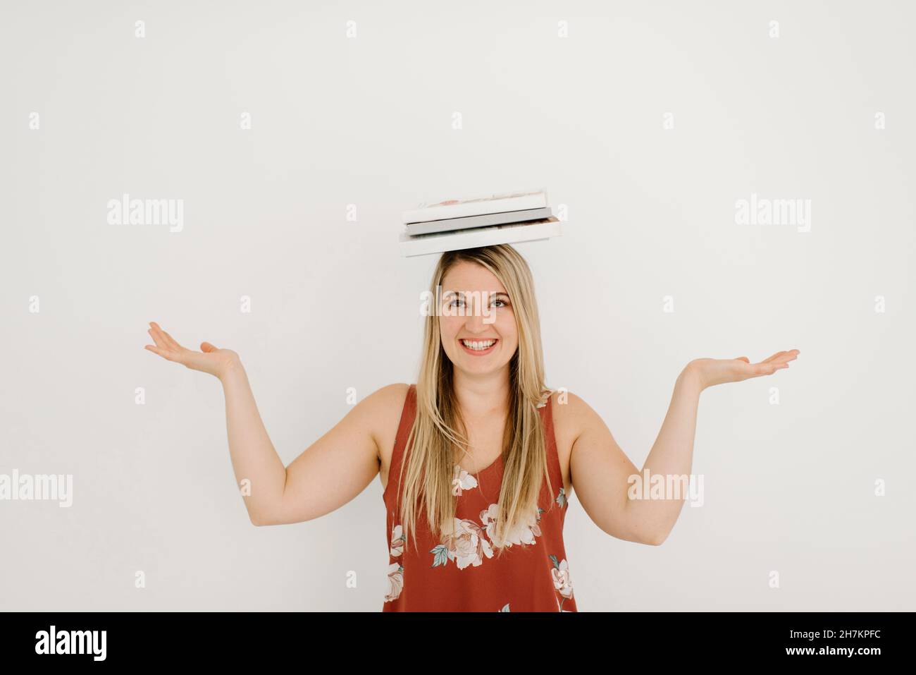 Woman balancing books head hi-res stock photography and images - Alamy