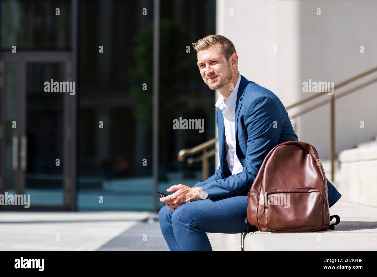 Sitting with backpack hi-res stock photography and images - Alamy