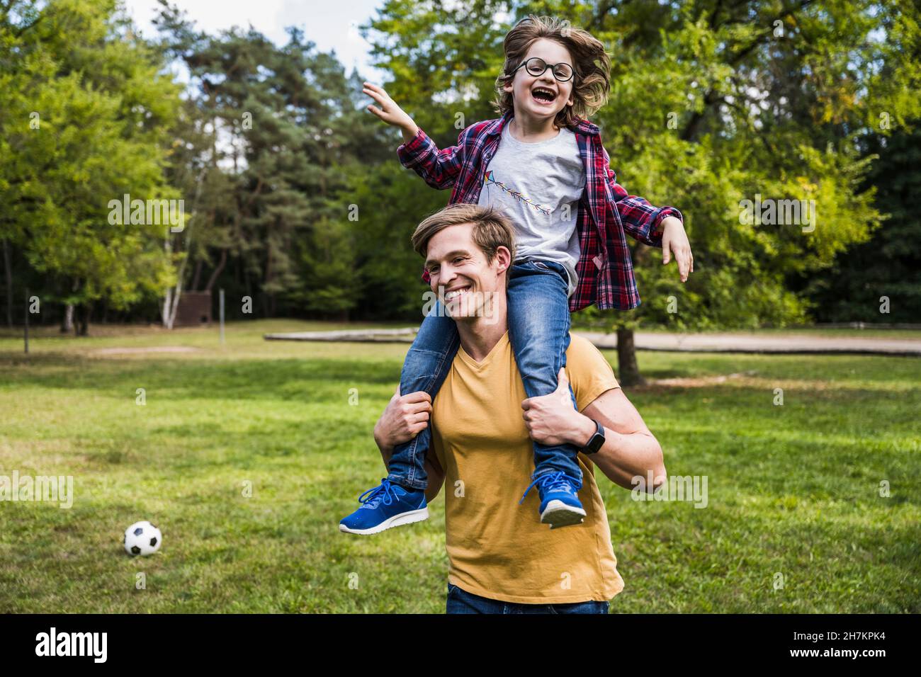 Man carrying a boy hi-res stock photography and images - Alamy