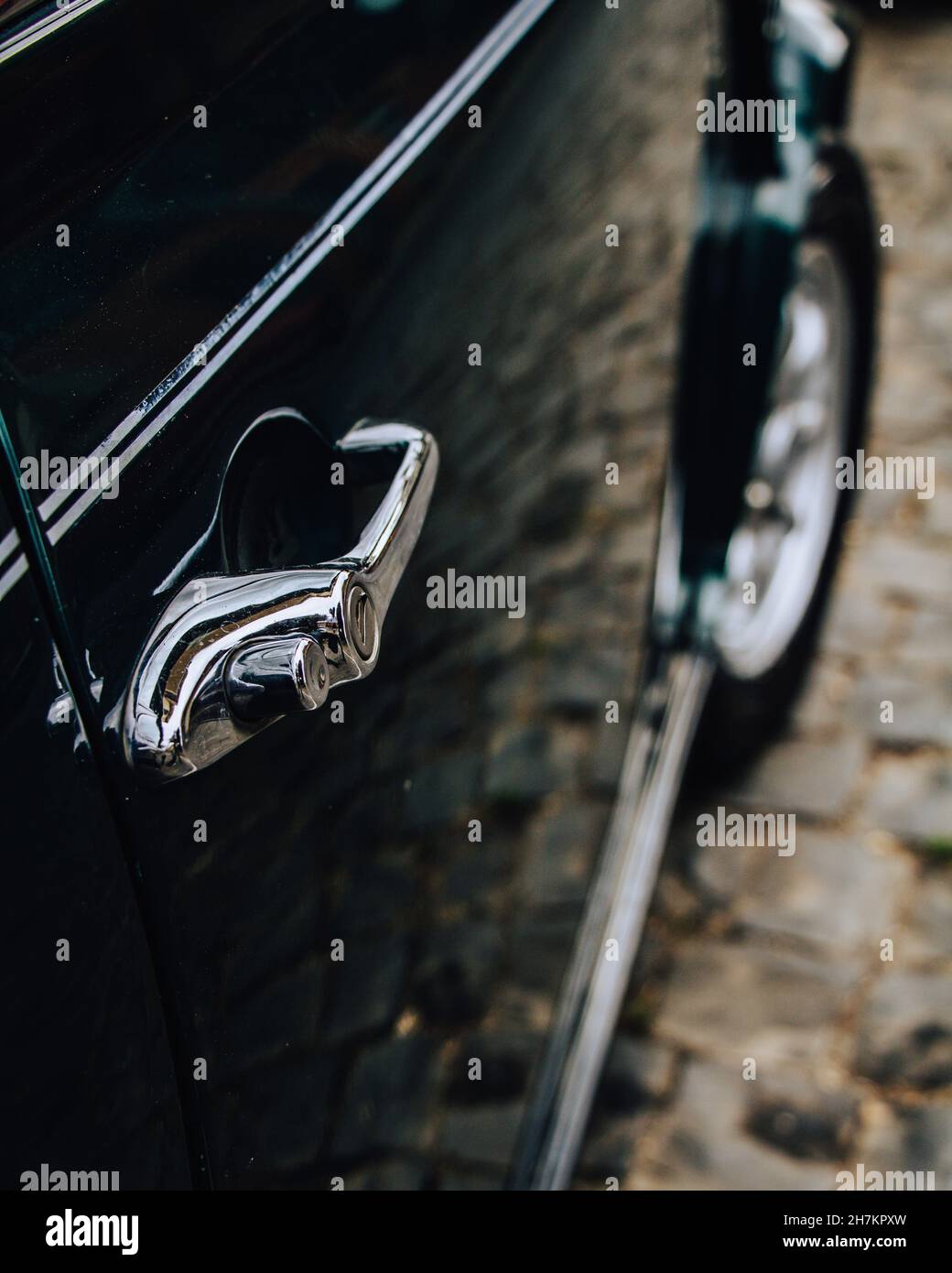 Black vintage car door handle and lock Stock Photo - Alamy