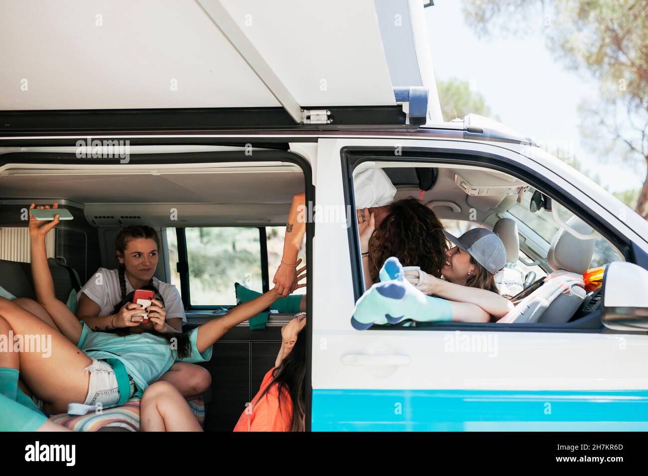 Female friends having fun in camper van Stock Photo - Alamy
