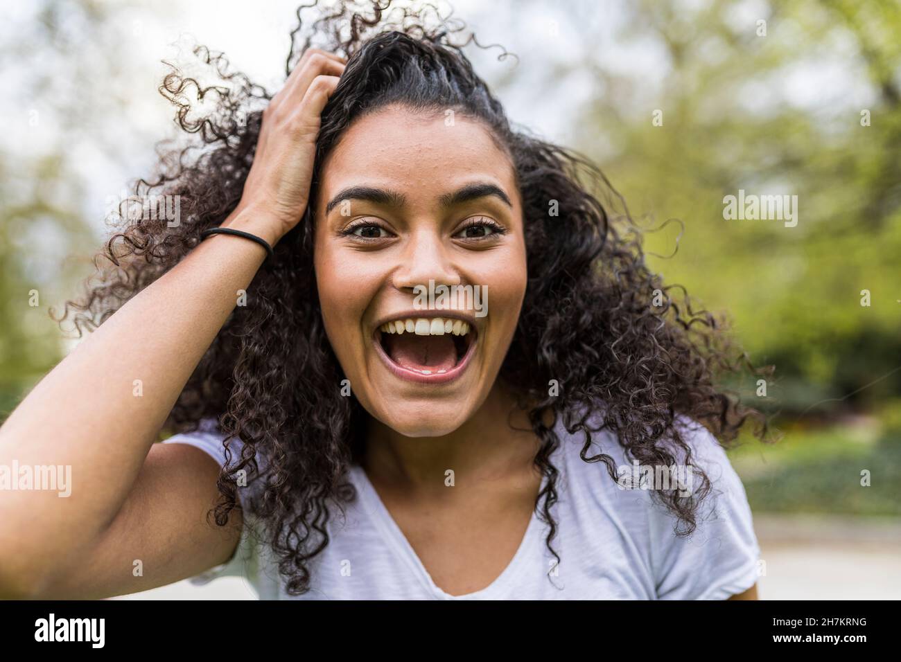 Smile woman hand on head hi-res stock photography and images - Alamy
