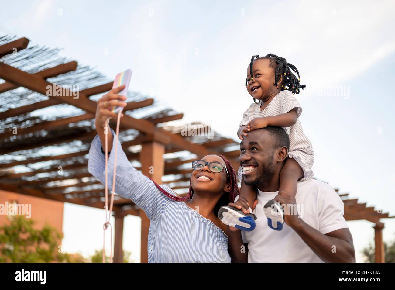 Woman taking selfie with family by roofing Stock Photo - Alamy