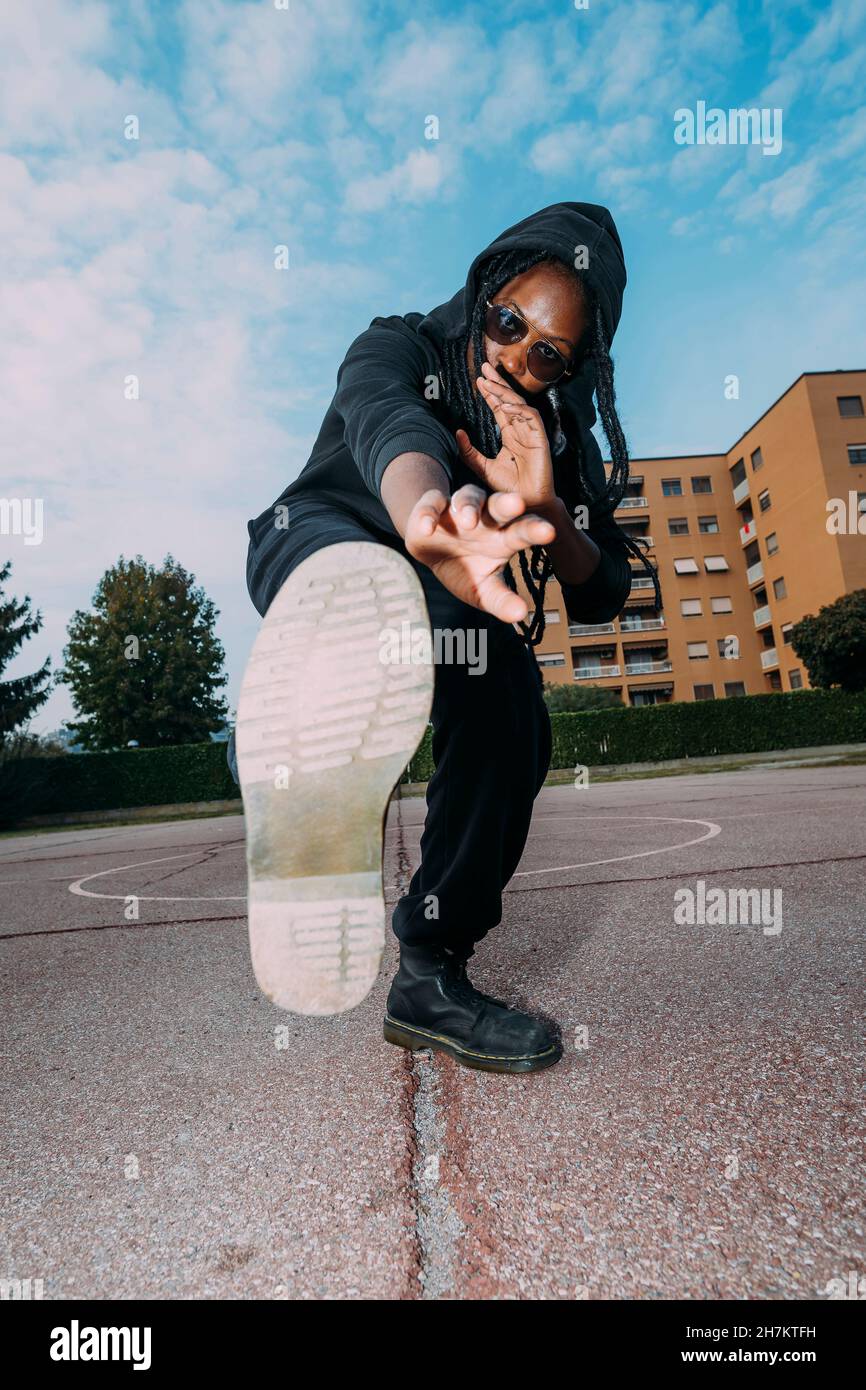 Woman dancing on basketball court Stock Photo - Alamy