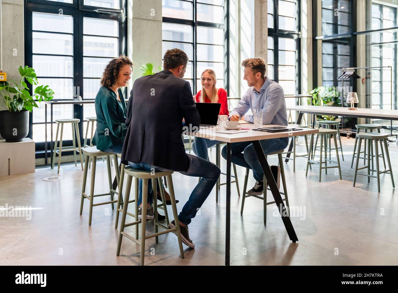 Employees having discussion in meeting at office Stock Photo - Alamy