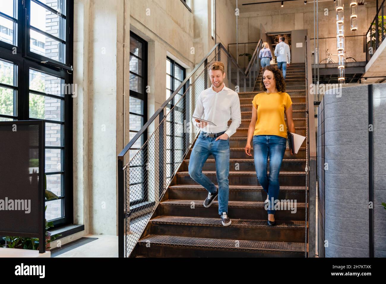 Walking down stairs computer hi-res stock photography and images - Alamy