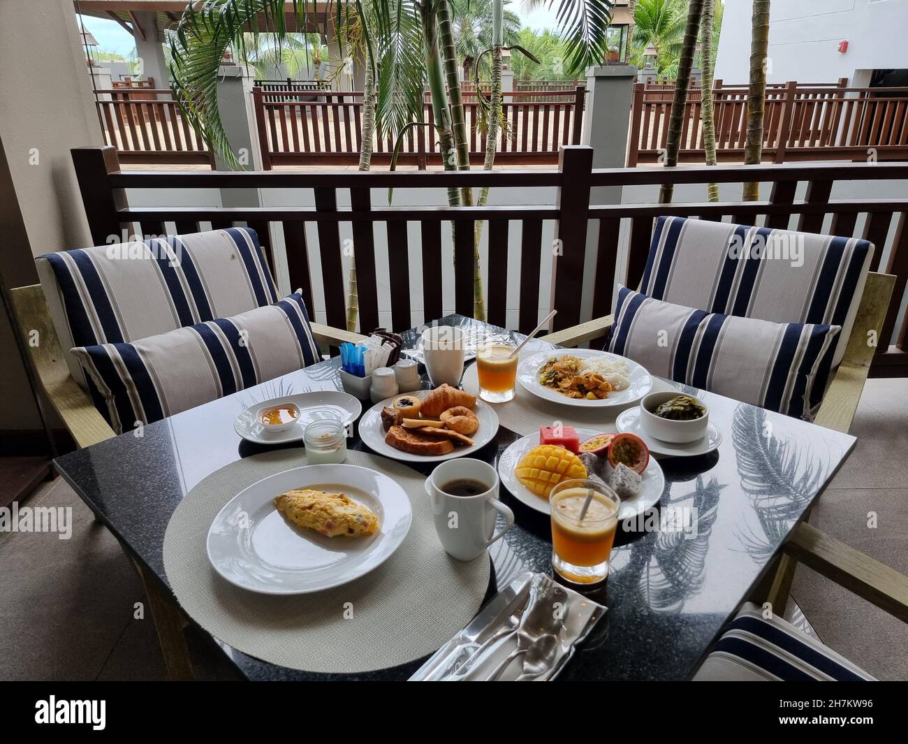 Luxury breakfast table with bread croissants and fruits and coffee ...