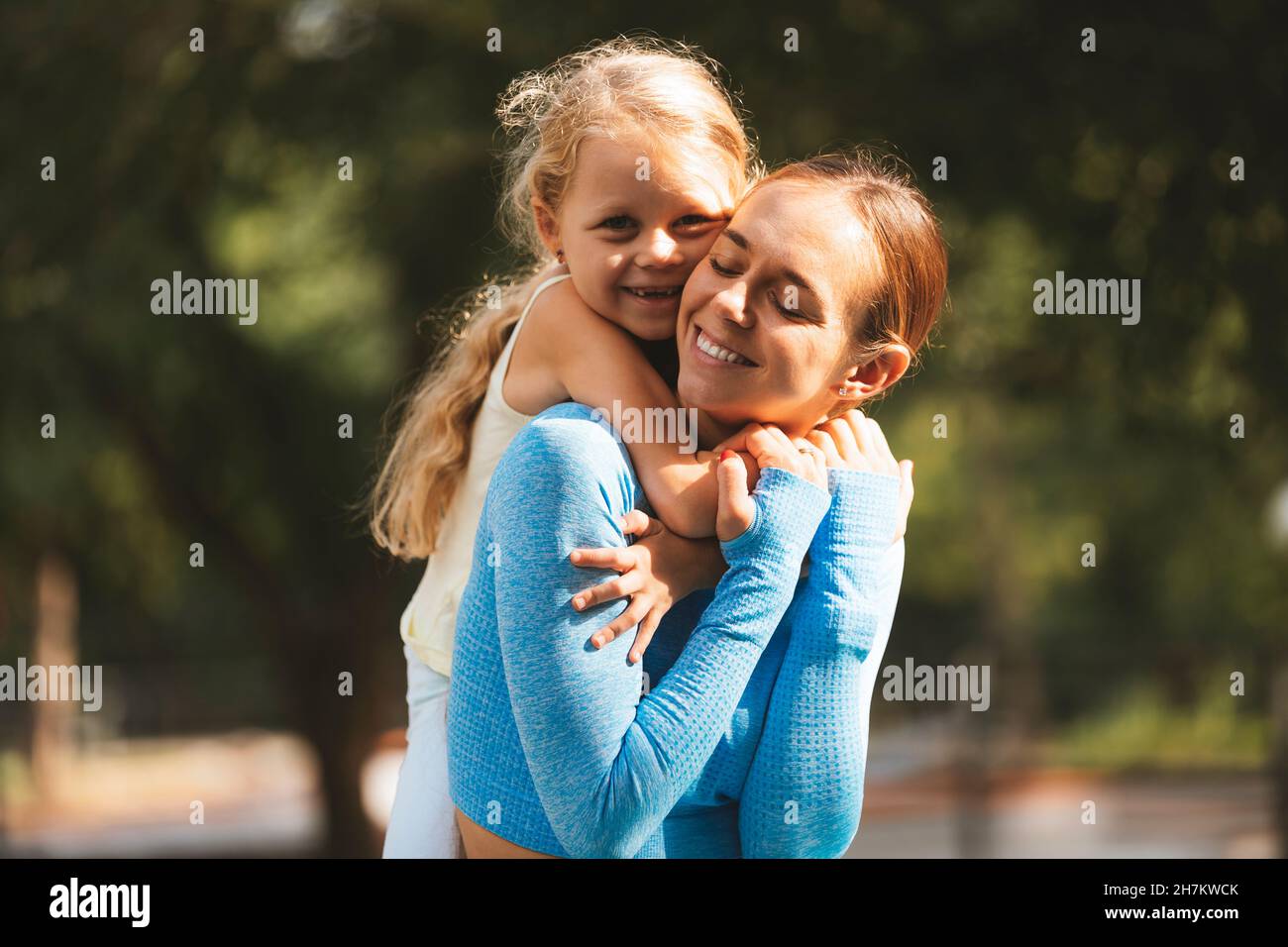 Two women giving piggyback on hi-res stock photography and images - Alamy