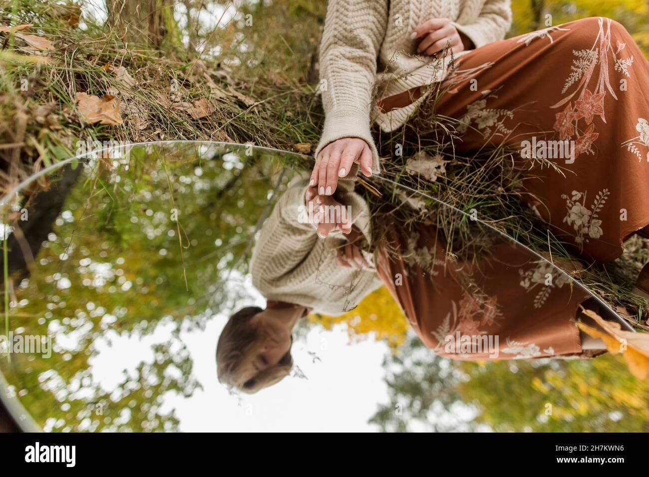Woman touching mirror at forest Stock Photo - Alamy