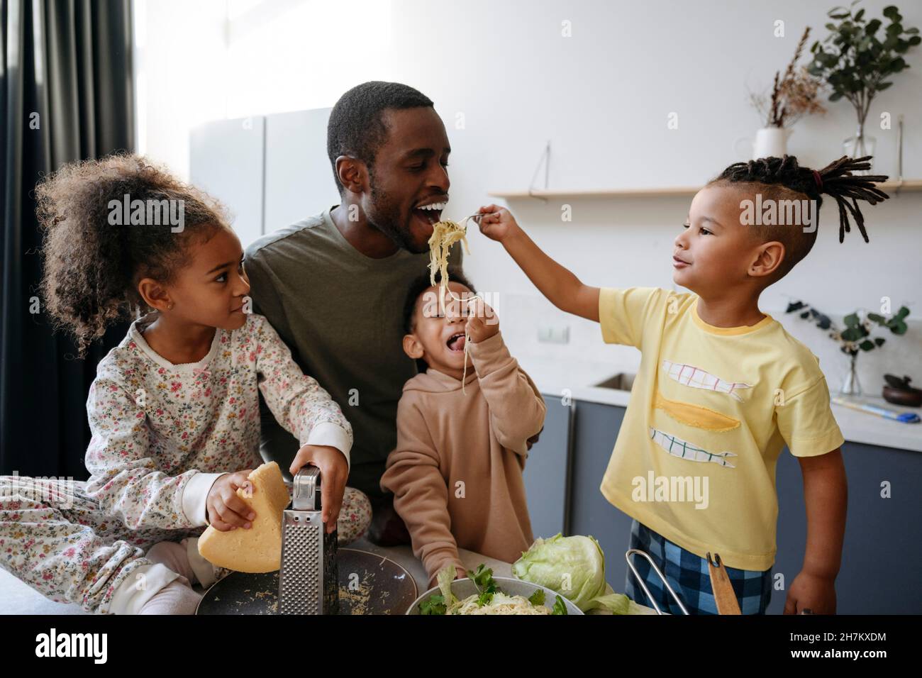 Girl feeding boy store