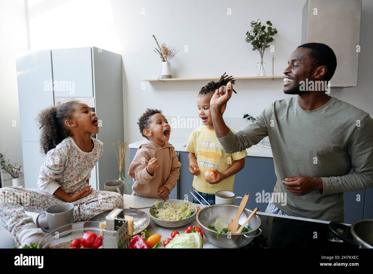 Father daughter playing in kitchen hi-res stock photography and images ...