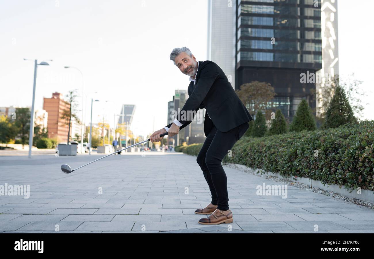 Business executive playing golf hi-res stock photography and images - Alamy