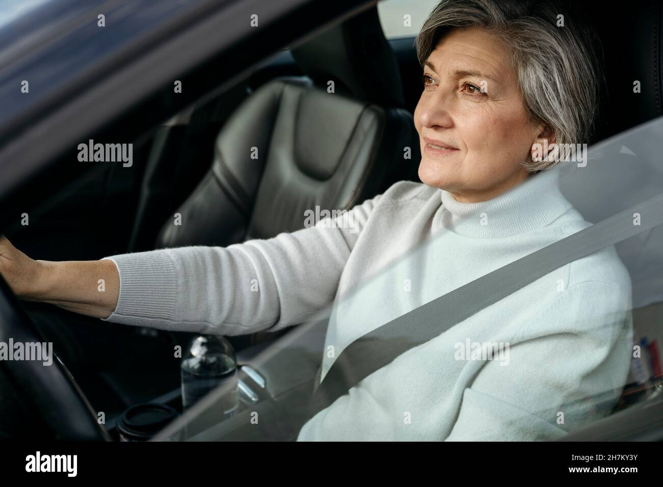 Senior woman driving hi-res stock photography and images - Alamy