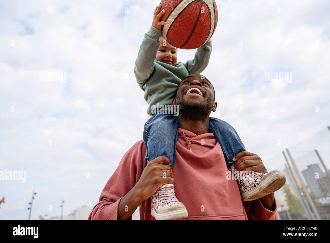 Man carrying basketball hi-res stock photography and images - Alamy