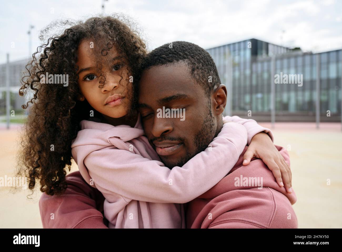 Daughter embracing father sports hi-res stock photography and images ...