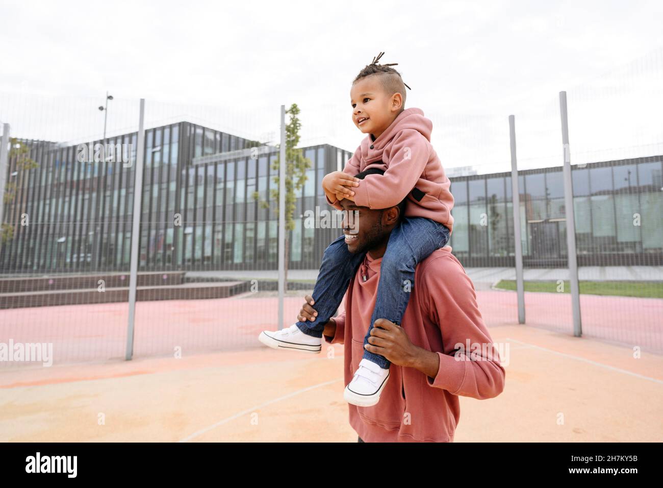 Man carrying boy shoulders hi-res stock photography and images - Alamy