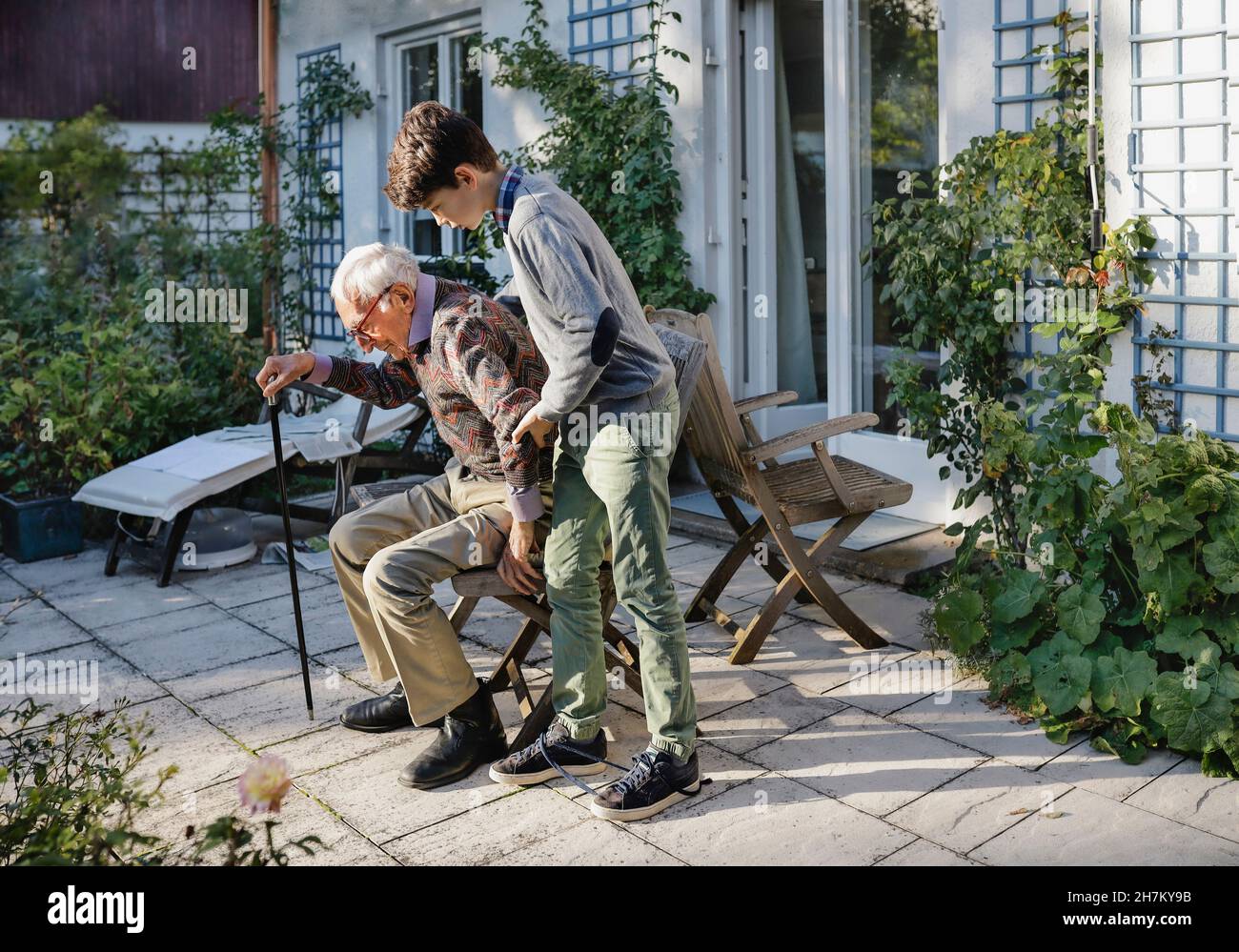 Old man helping hand boy hi-res stock photography and images - Alamy