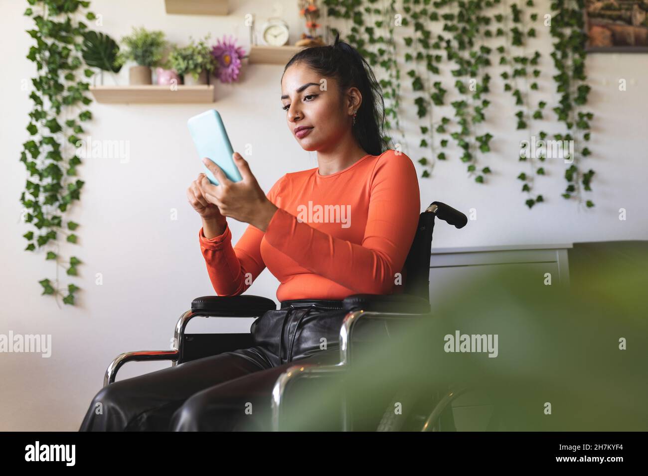 Young disabled woman reading book at home Stock Photo - Alamy