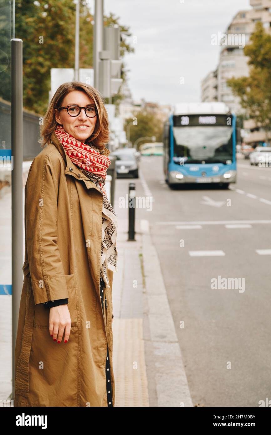 Three women standing bus stop hi-res stock photography and images - Alamy