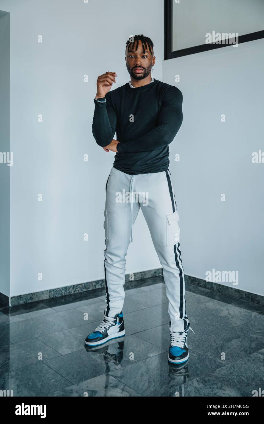 Confident young man standing Stock Photo - Alamy