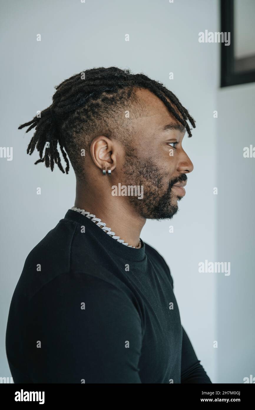 Young bearded man with locs hairstyle Stock Photo - Alamy