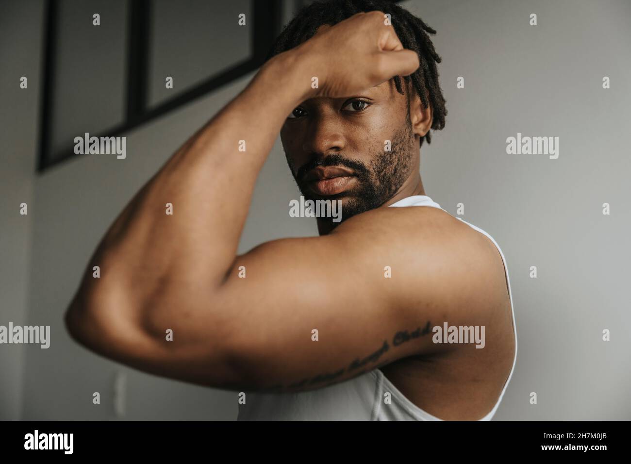 Man flexing muscles Stock Photo - Alamy