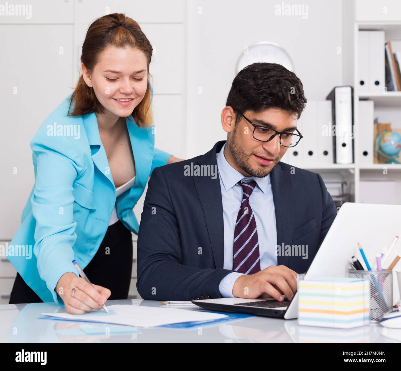 Business partners working in office Stock Photo - Alamy