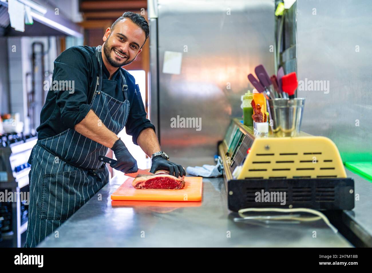 Cutting meat hi-res stock photography and images - Alamy