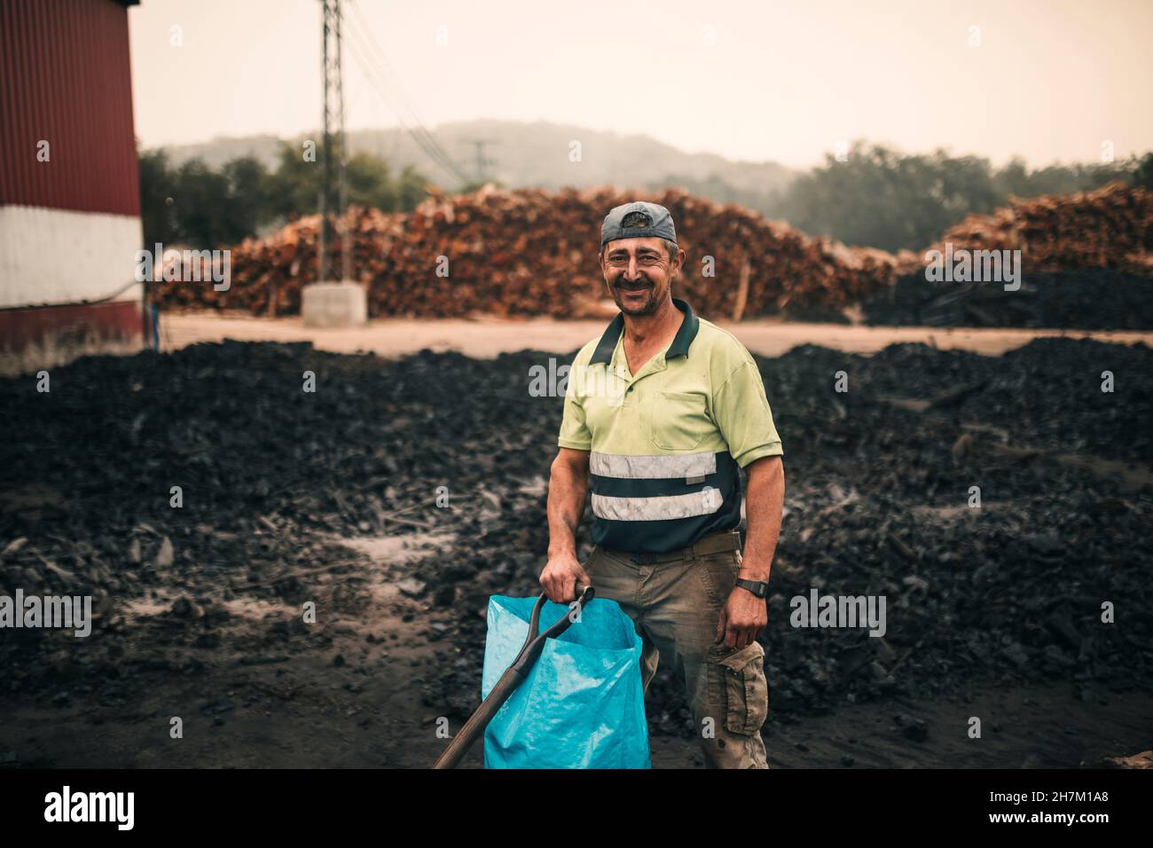 Workers working at coal factory Stock Photo - Alamy