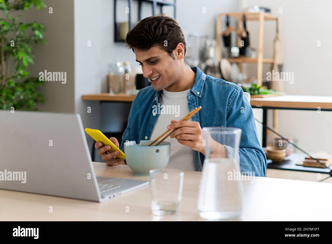 Young asian phone home hi-res stock photography and images - Alamy