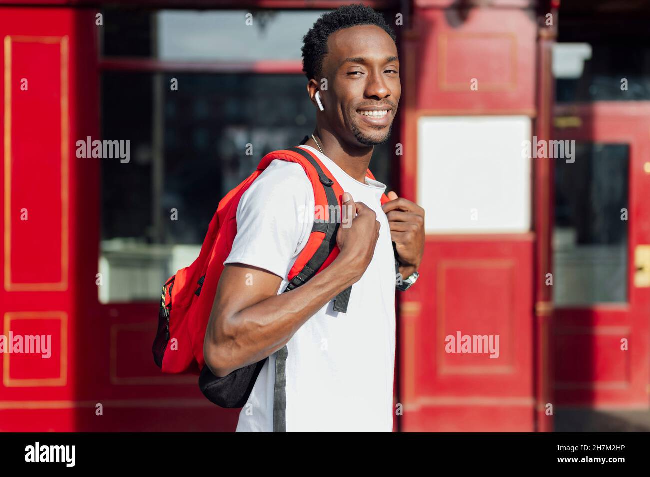 Man carrying backpack side view hi-res stock photography and images - Alamy