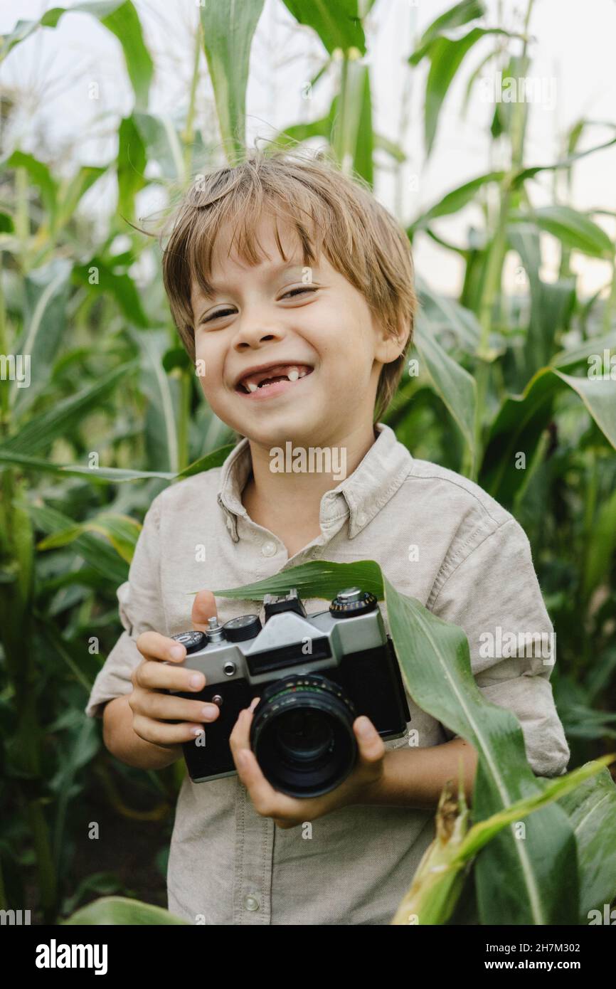 Boy standing looking at camera hi-res stock photography and images - Alamy