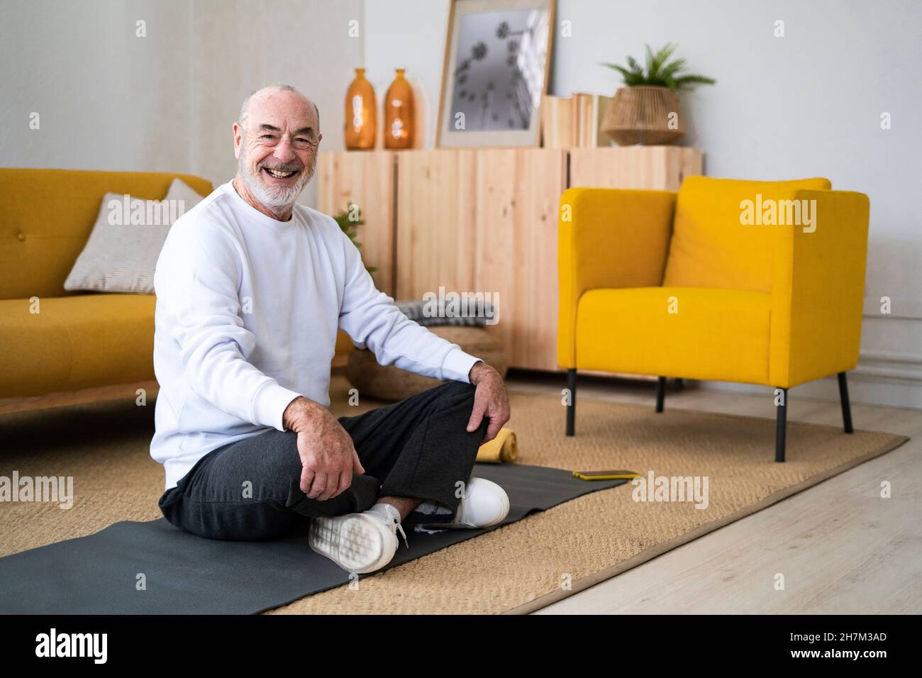 Senior exercise indoors vertical hi-res stock photography and images ...