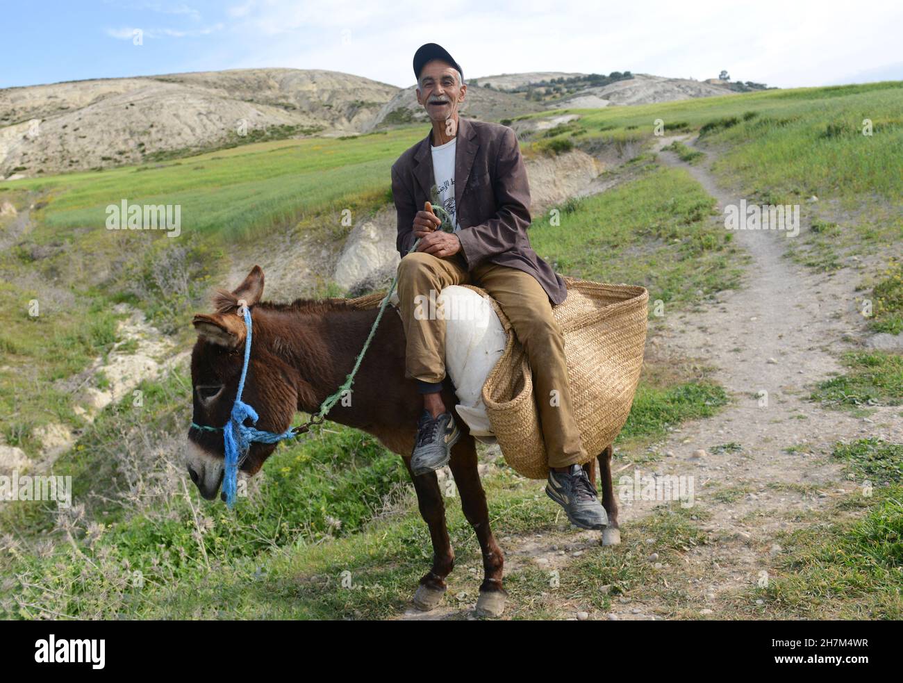 A Moroccan man riding his donkey in northern Morocco Stock Photo - Alamy