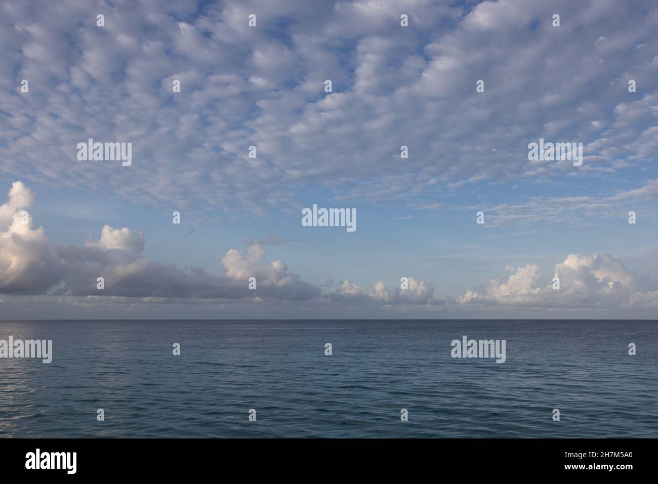 Morning seascape. The sea with soft clouds above it Stock Photo - Alamy