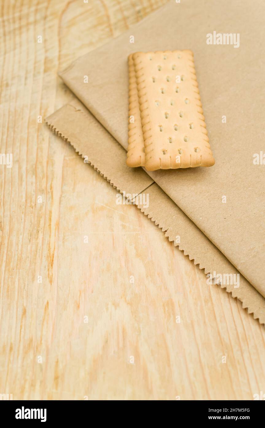 bio organic biscuits on a food paper and rustic wooden background Stock ...
