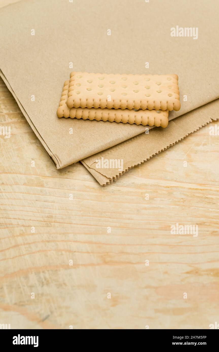 bio organic biscuits on a food paper and rustic wooden background Stock ...