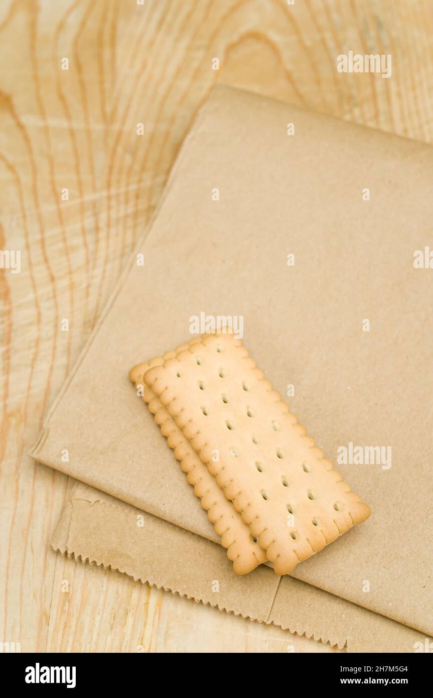 bio organic biscuits on a food paper and rustic wooden background Stock ...