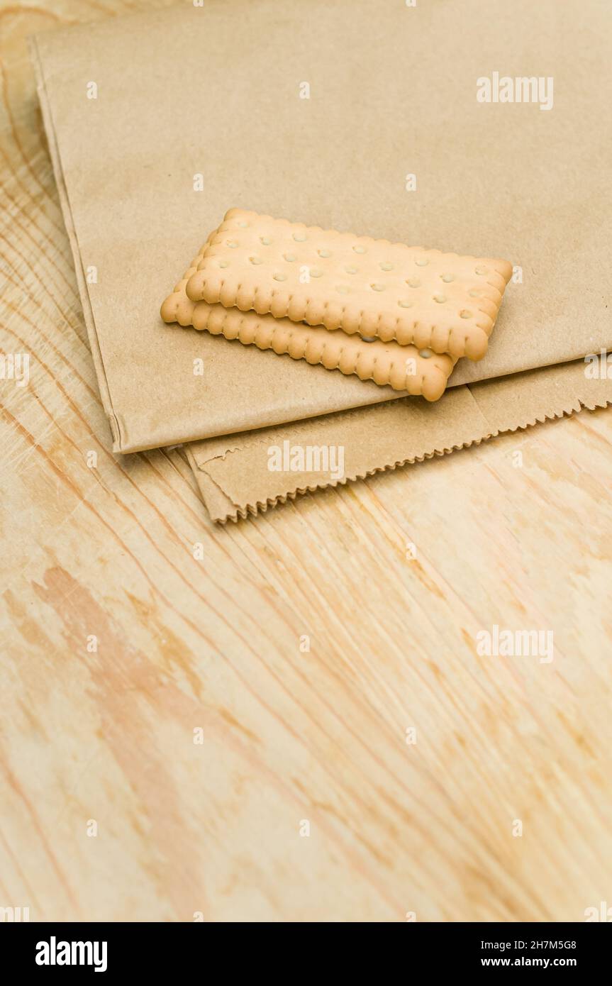 bio organic biscuits on a food paper and rustic wooden background Stock ...